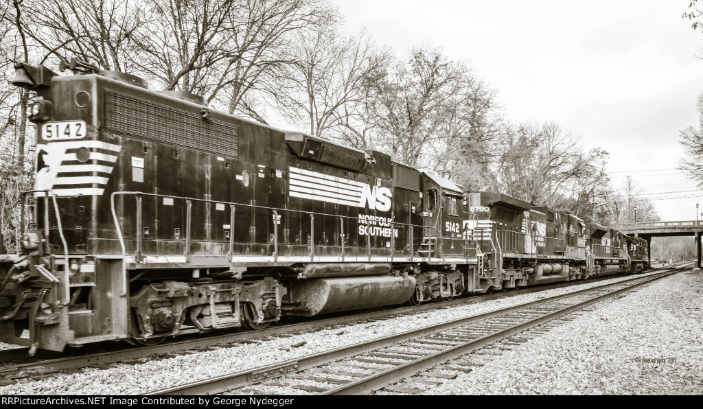 NS a long mixed freight train is leaving